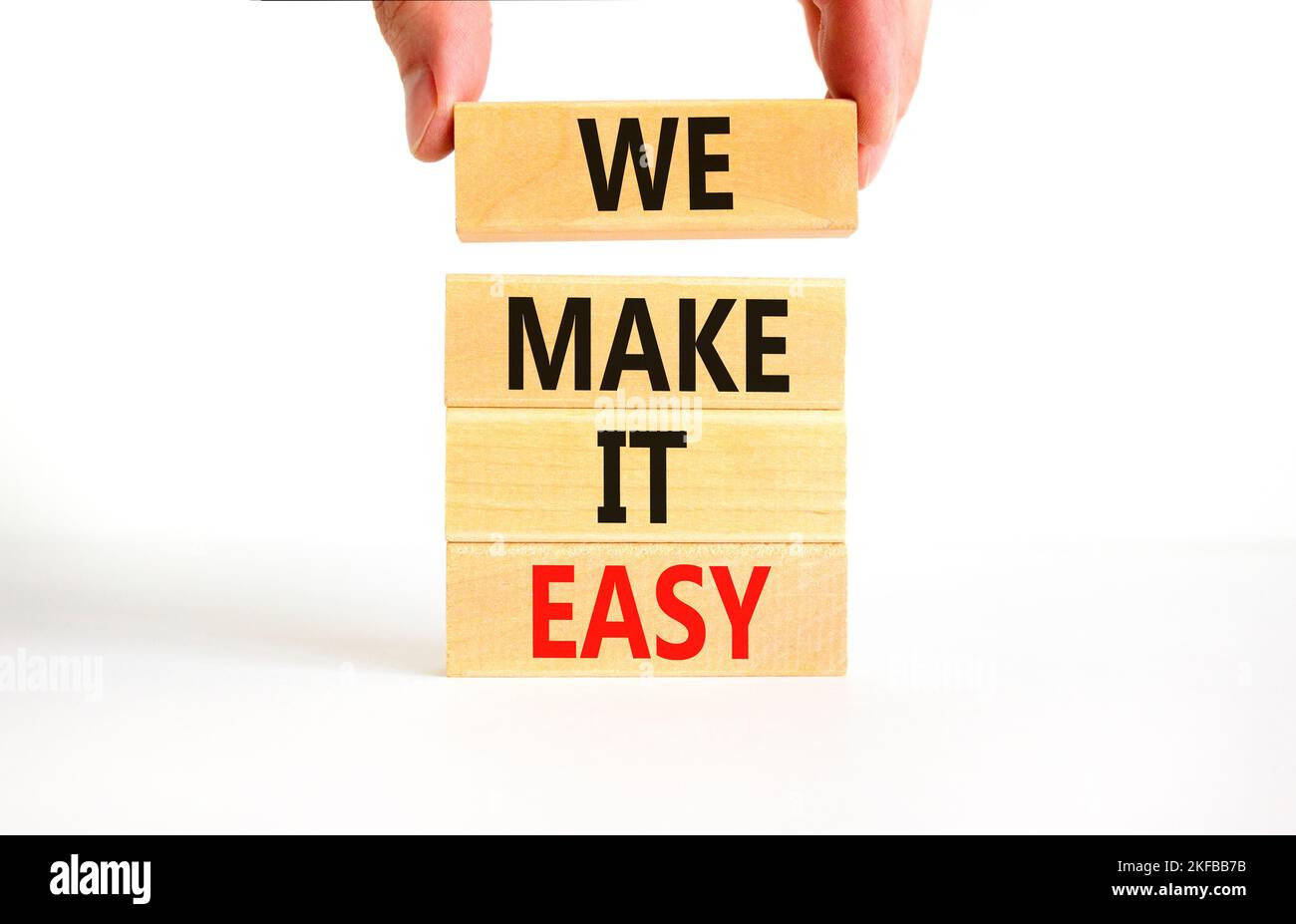 We make it easy symbol. Concept words We make it easy on wooden cubes ...