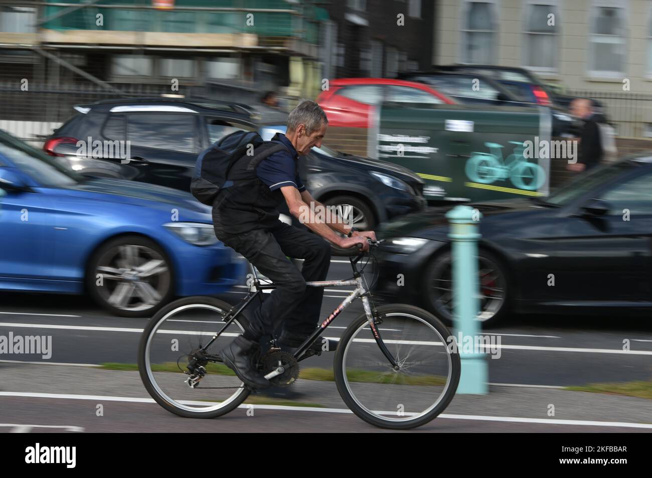 Cyclists riding along cycle lane on brighton seafront Stock Photo - Alamy