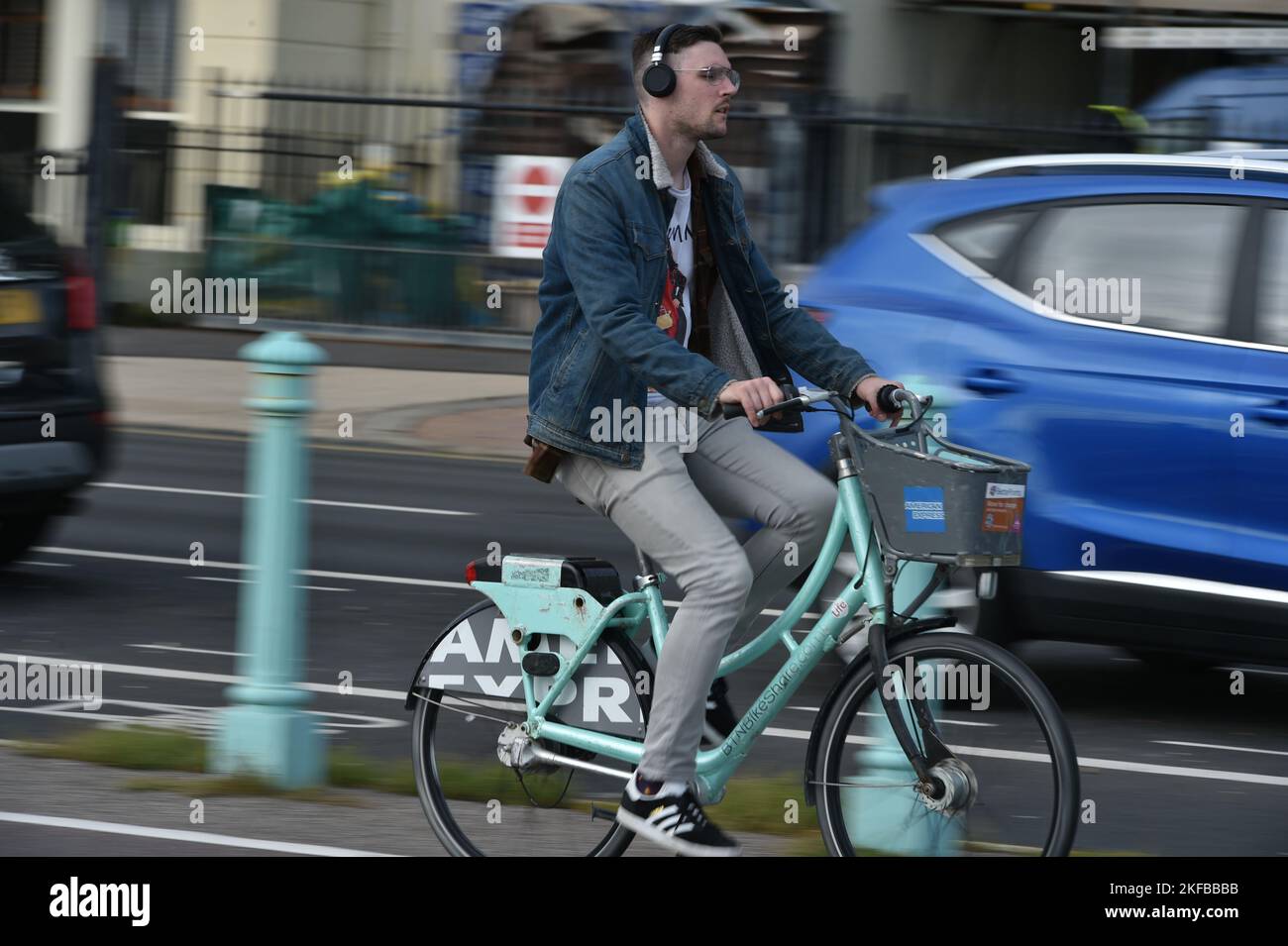 Cyclists riding along cycle lane on brighton seafront Stock Photo - Alamy