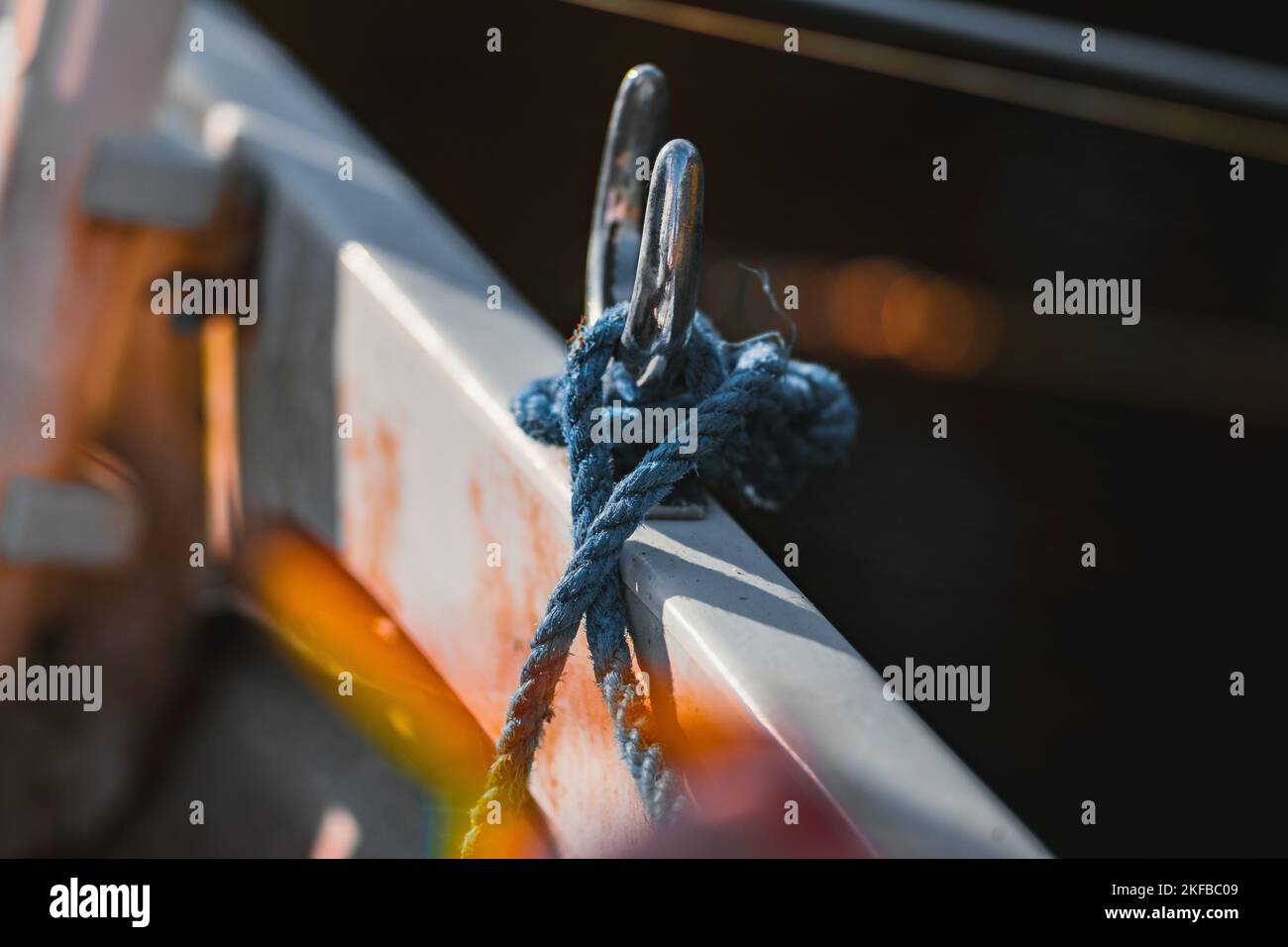 A close-up shot of a rope tied to a sailboat hook Stock Photo - Alamy