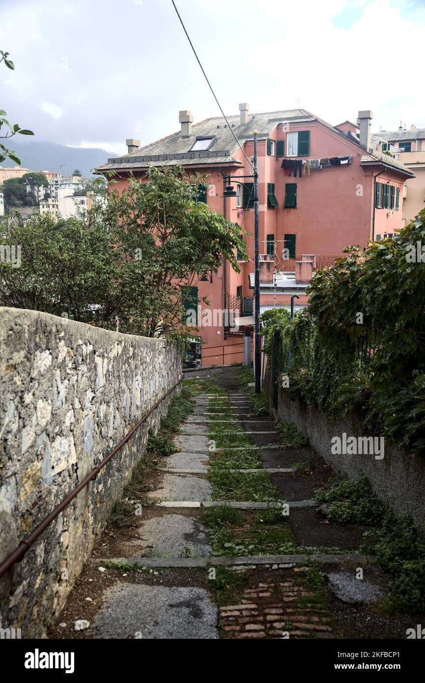 Descending staircase bordered by stone wall Stock Photo - Alamy