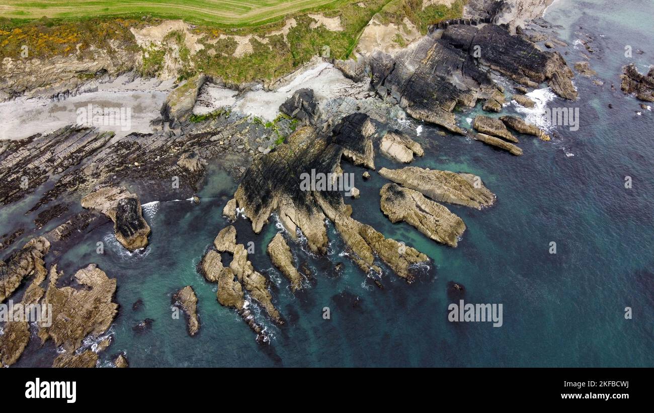 Rocks on the Irish shore, top view. The coast of the Atlantic Ocean ...