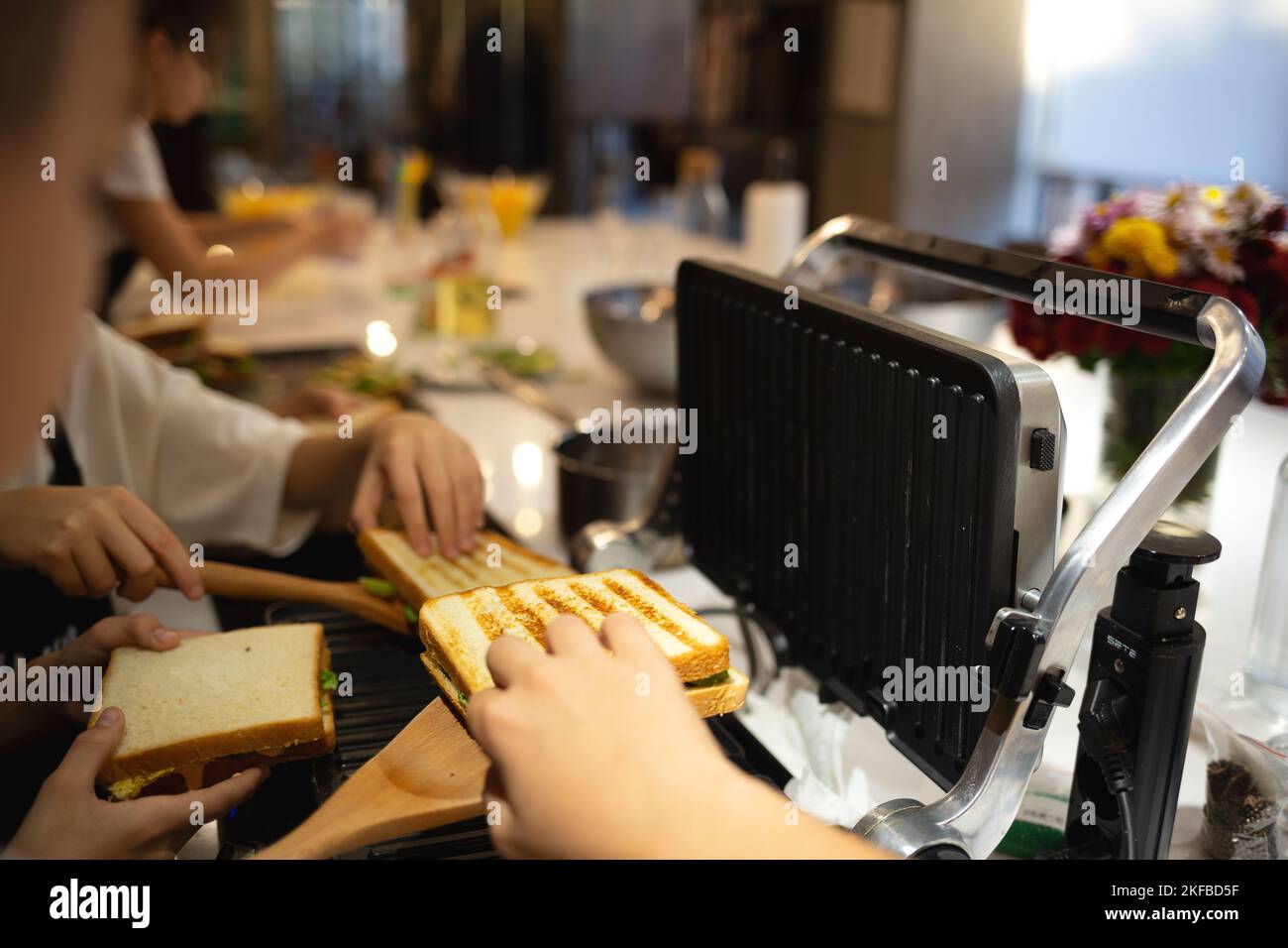 close-up shot. hands holding fresh chicken toast at cooking classes ...