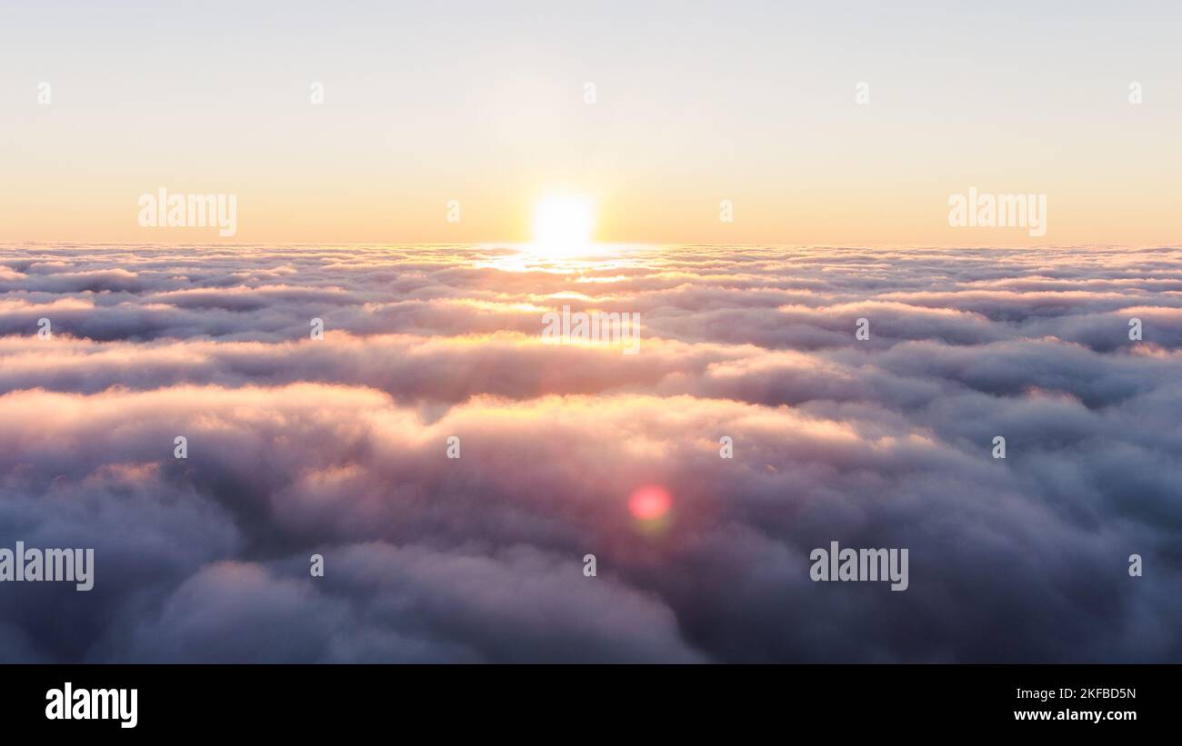 Sunset over waves of heavy thick fog. Dark clouds of fog. The sun ...
