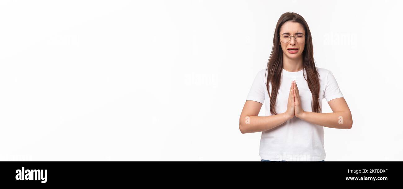 Waist-up portrait of desperate, hopeful young cute girl, sobbing and ...