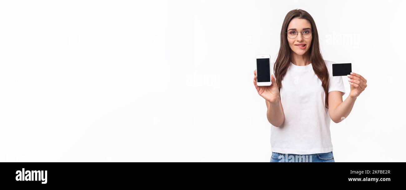 Portrait of excited and tempting young woman likes shopping, cant wait ...