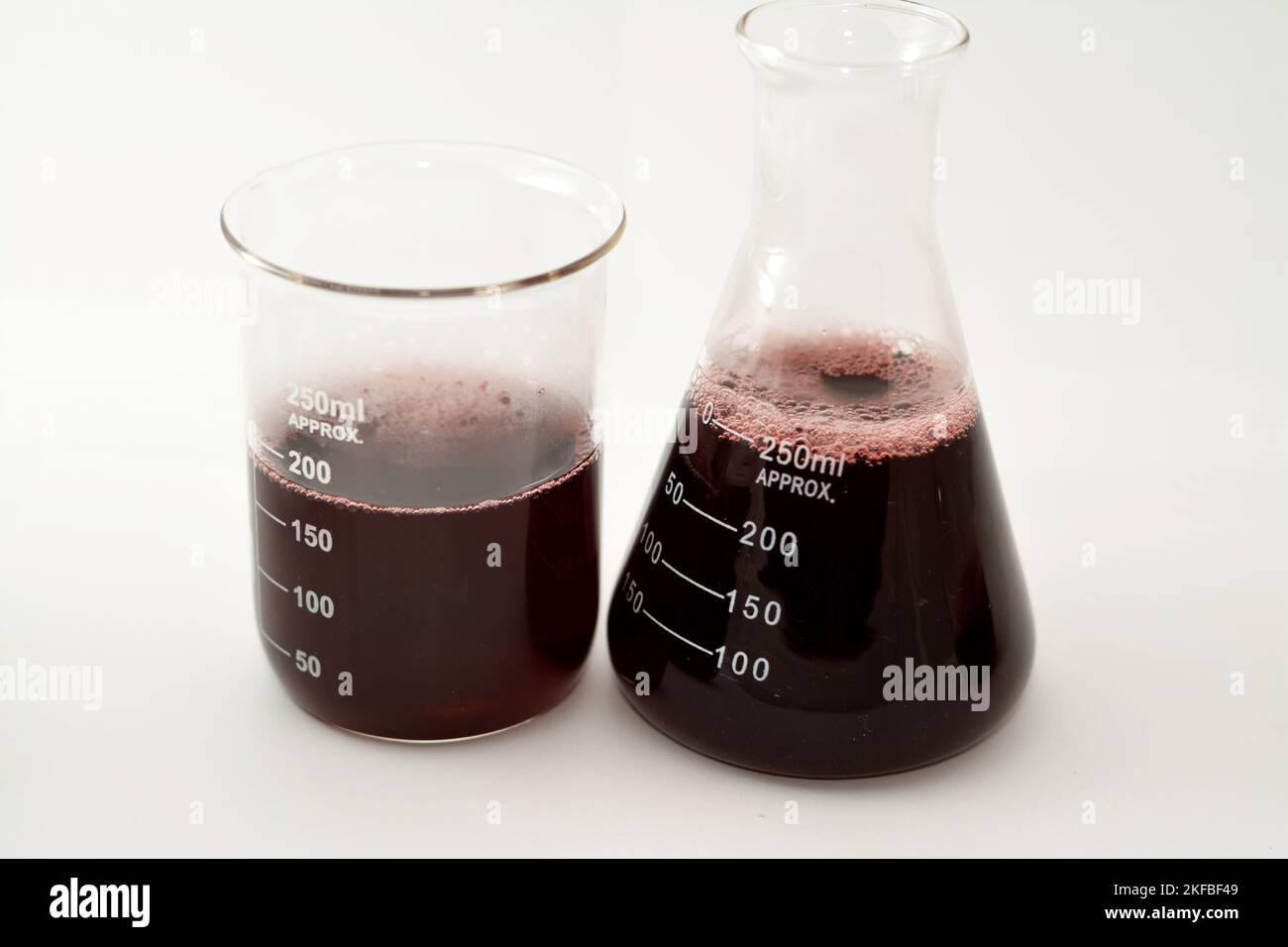 A laboratory set of glassware of conical and volumetric flasks that ...