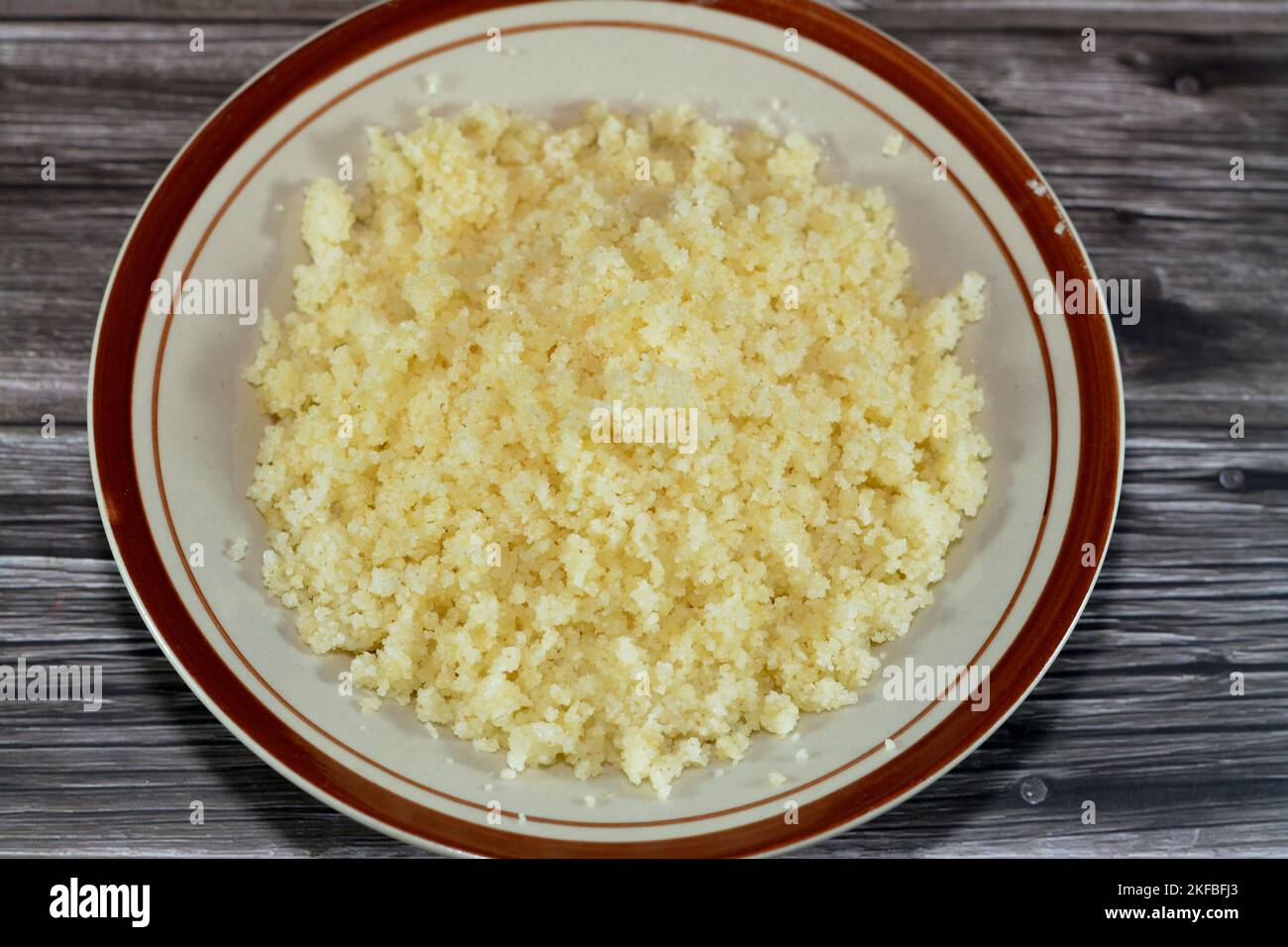 Arabian Cuisine dish of small steamed granules of rolled durum wheat ...