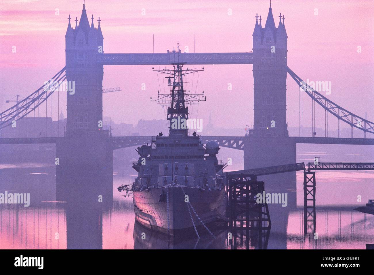 London River Thames, view at dawn of Tower Bridge with HMS Belfast at ...