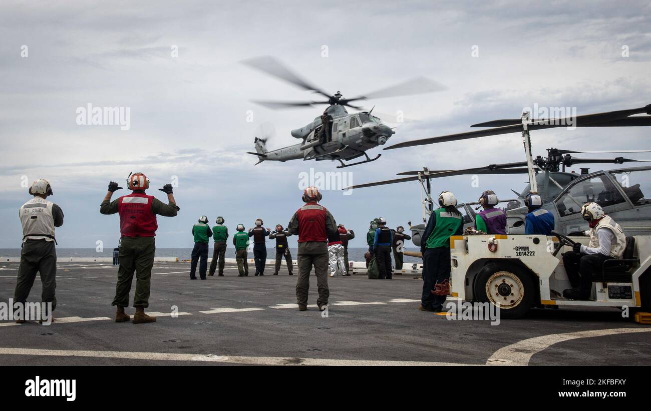 U.S. Marines and Sailors aboard USS New Orleans (LPD 18) observe a U-1Y ...