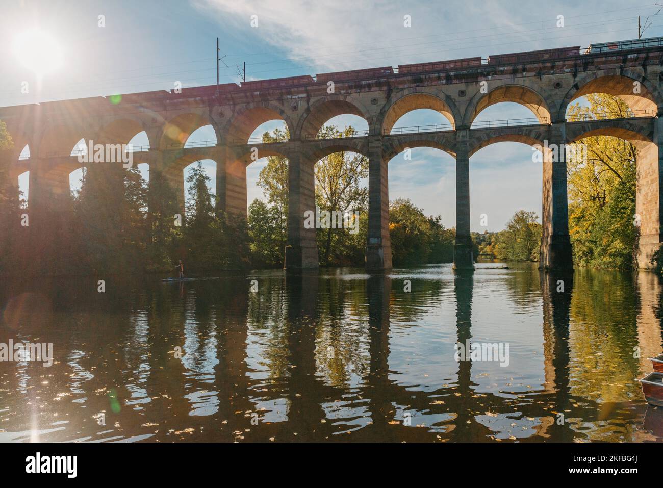 Germany train passing train bridge on cloudy day in germany hi-res ...