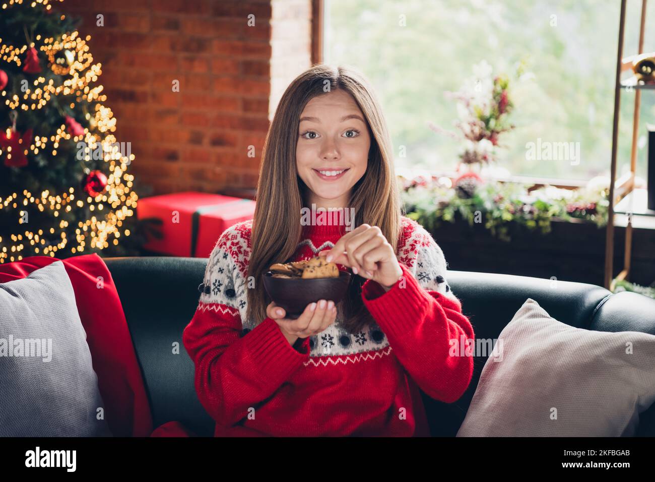 Photo of lovely peaceful girl sitting couch hands hold baked chocolate ...