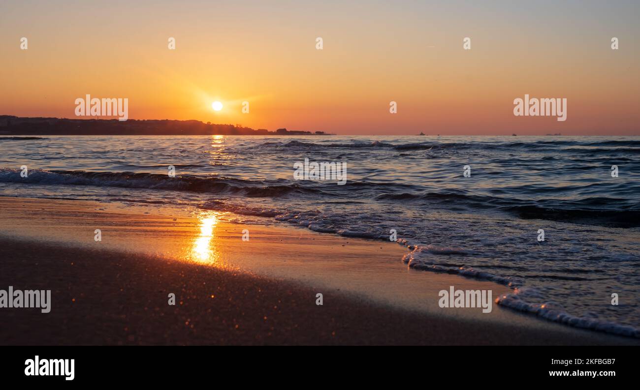 Colorful ocean beach sunrise and copy space. Beautiful beach scenery ...