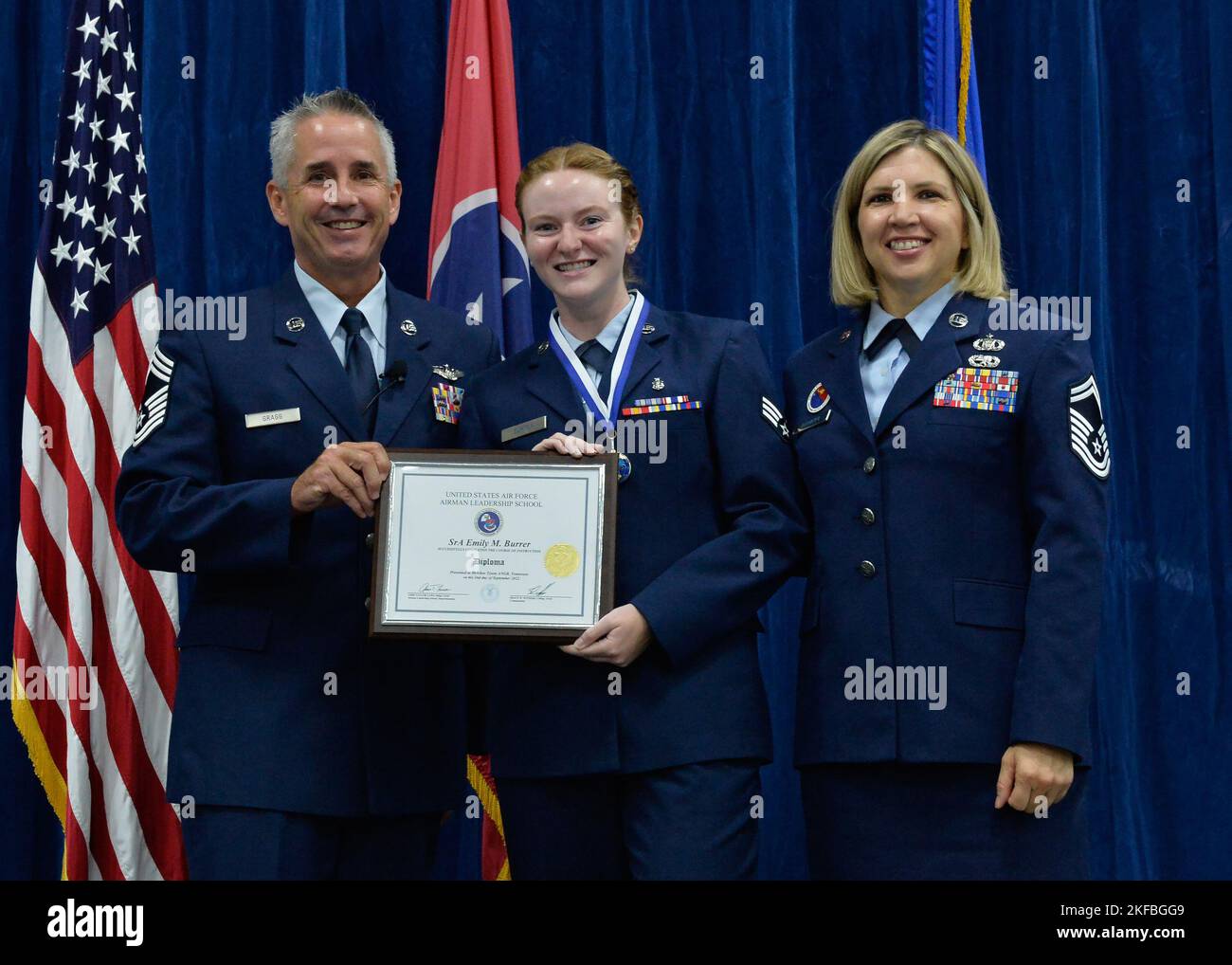 U.S. Air Force Senior Airman Emily Burrer receives the Distinguished ...