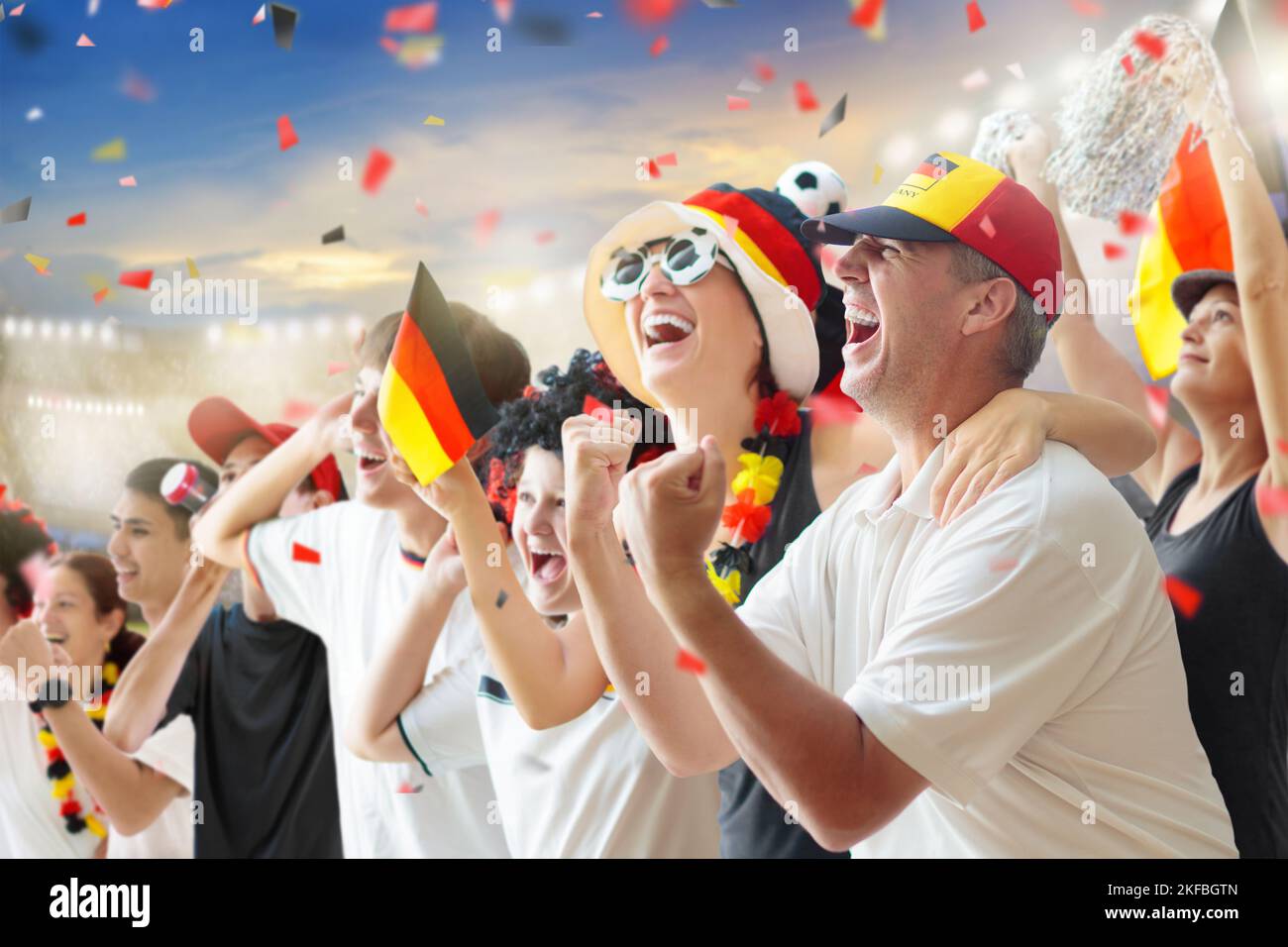 Germany football supporter on stadium. German fans on soccer pitch ...
