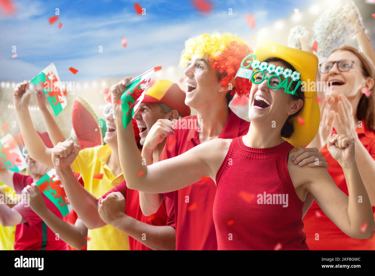 Wales fans on stadium. Welsh supporters. Crowd cheering for Wales ...