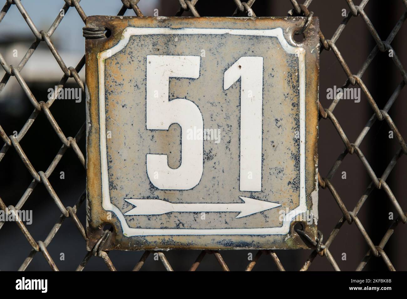 Weathered grunge square metal enameled plate of number of street ...