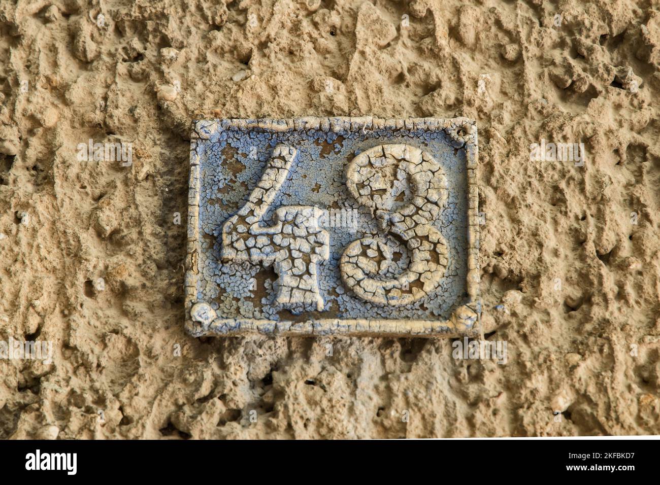 Old retro weathered cast iron plate number 43 closeup Stock Photo - Alamy