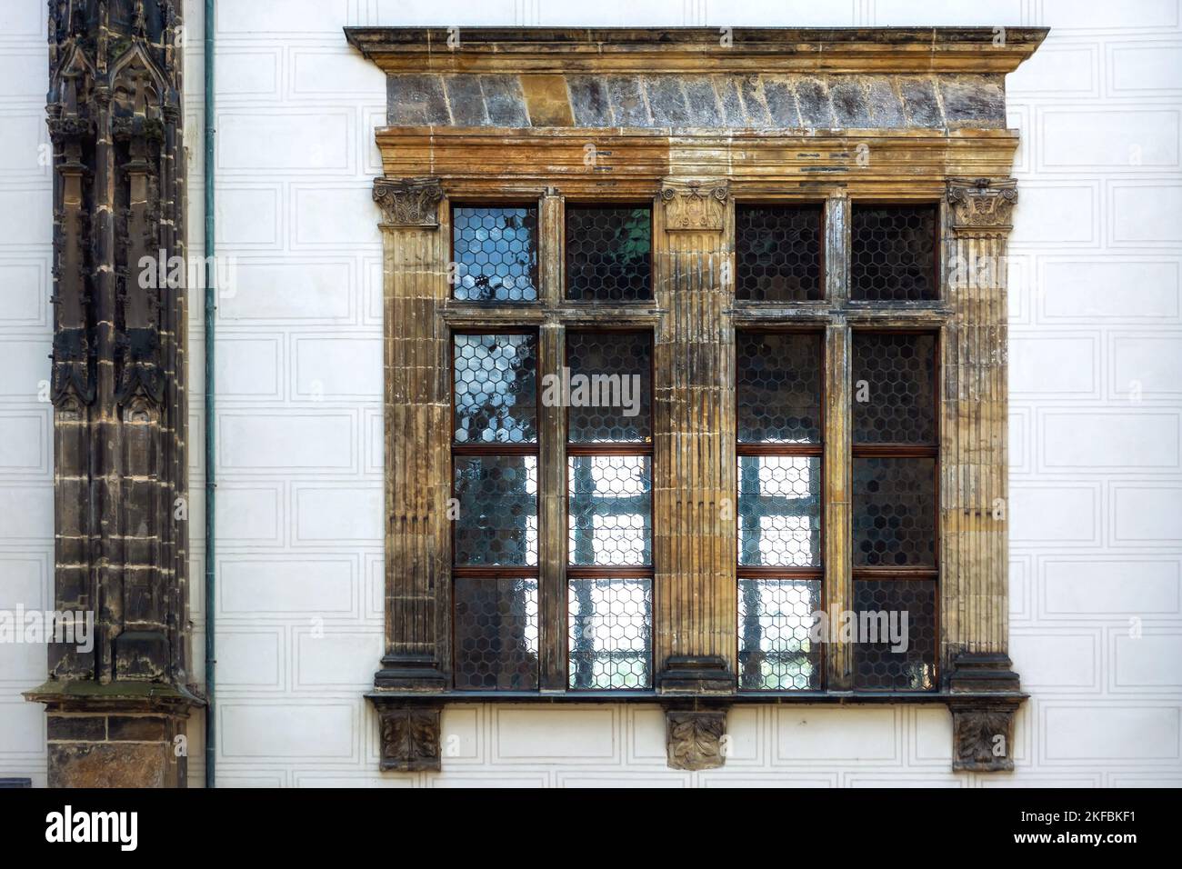 Rectangular window with a marble border and a marble column against a ...
