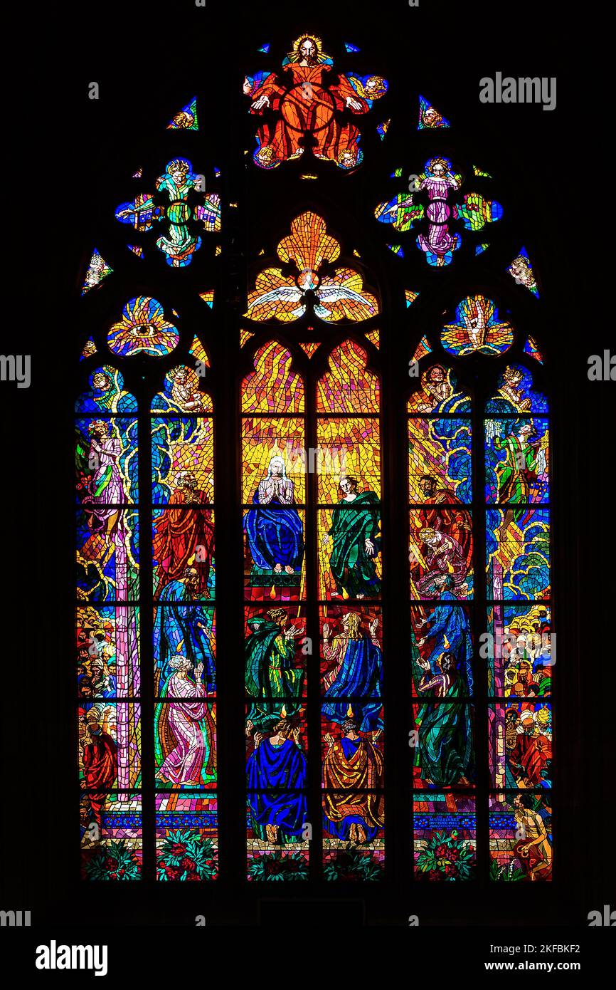 Arched window with stained glass stained glass on religious themes on a ...
