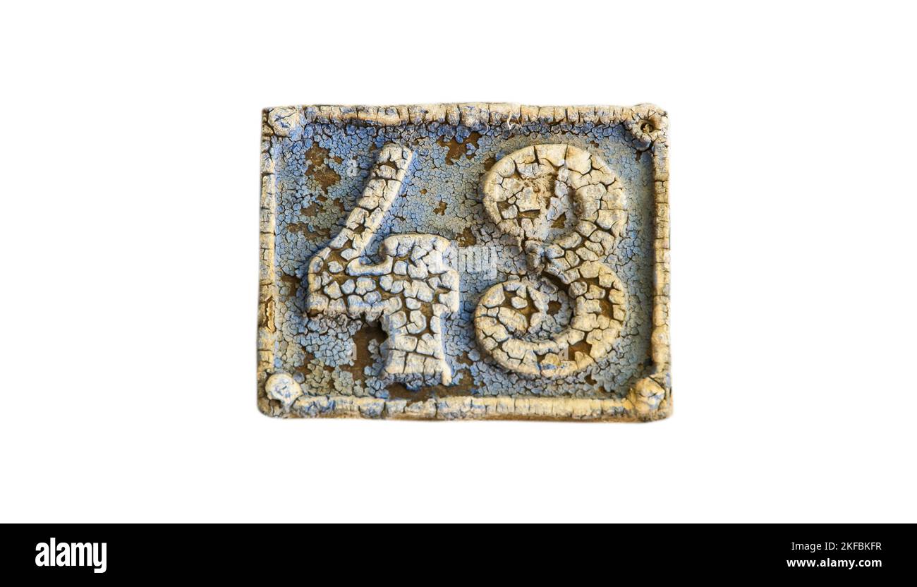 Old retro weathered cast iron plate with number 43 closeup isolated on ...