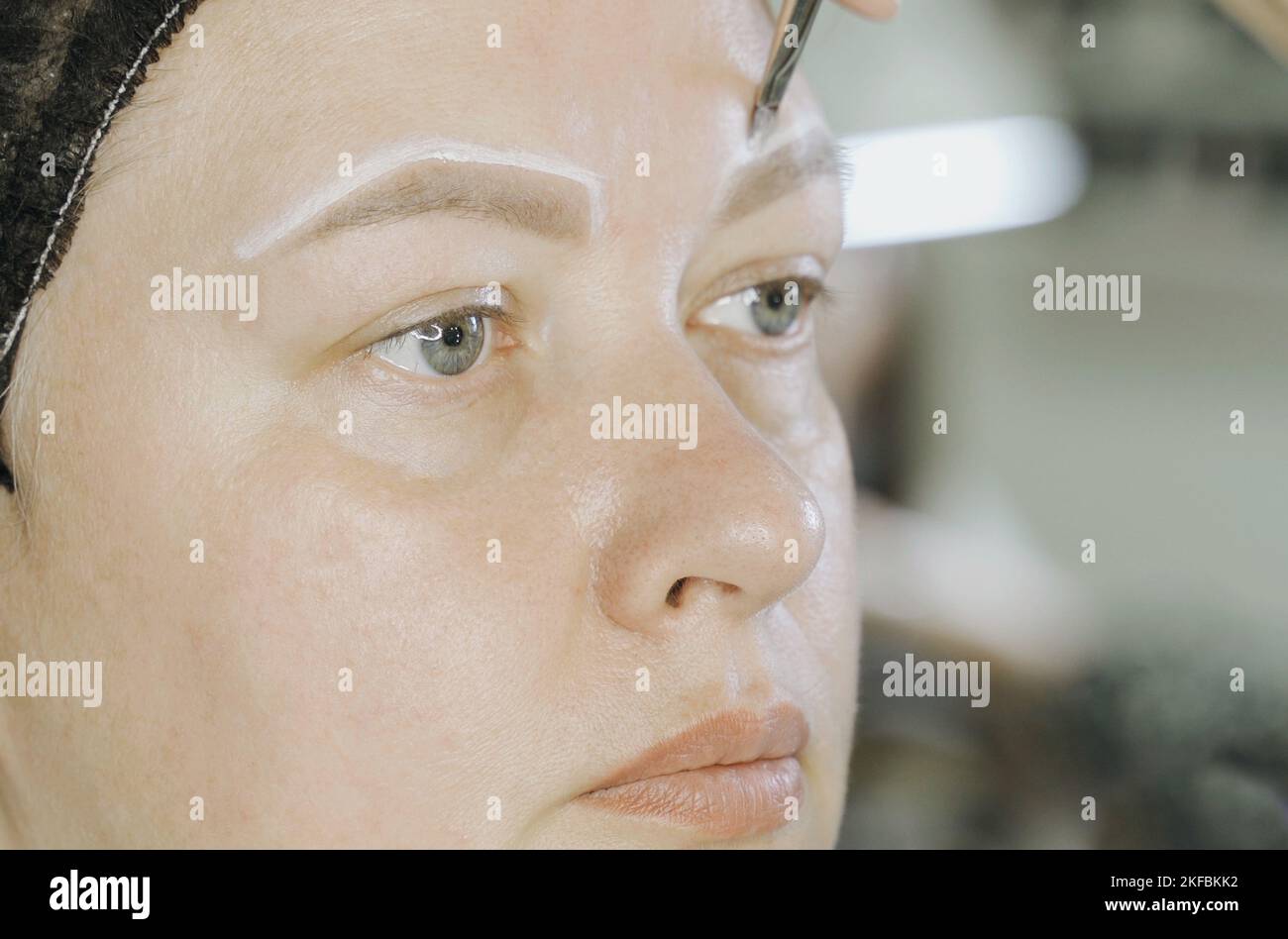 Coloring with white lines the design of the shape of the eyebrows on ...