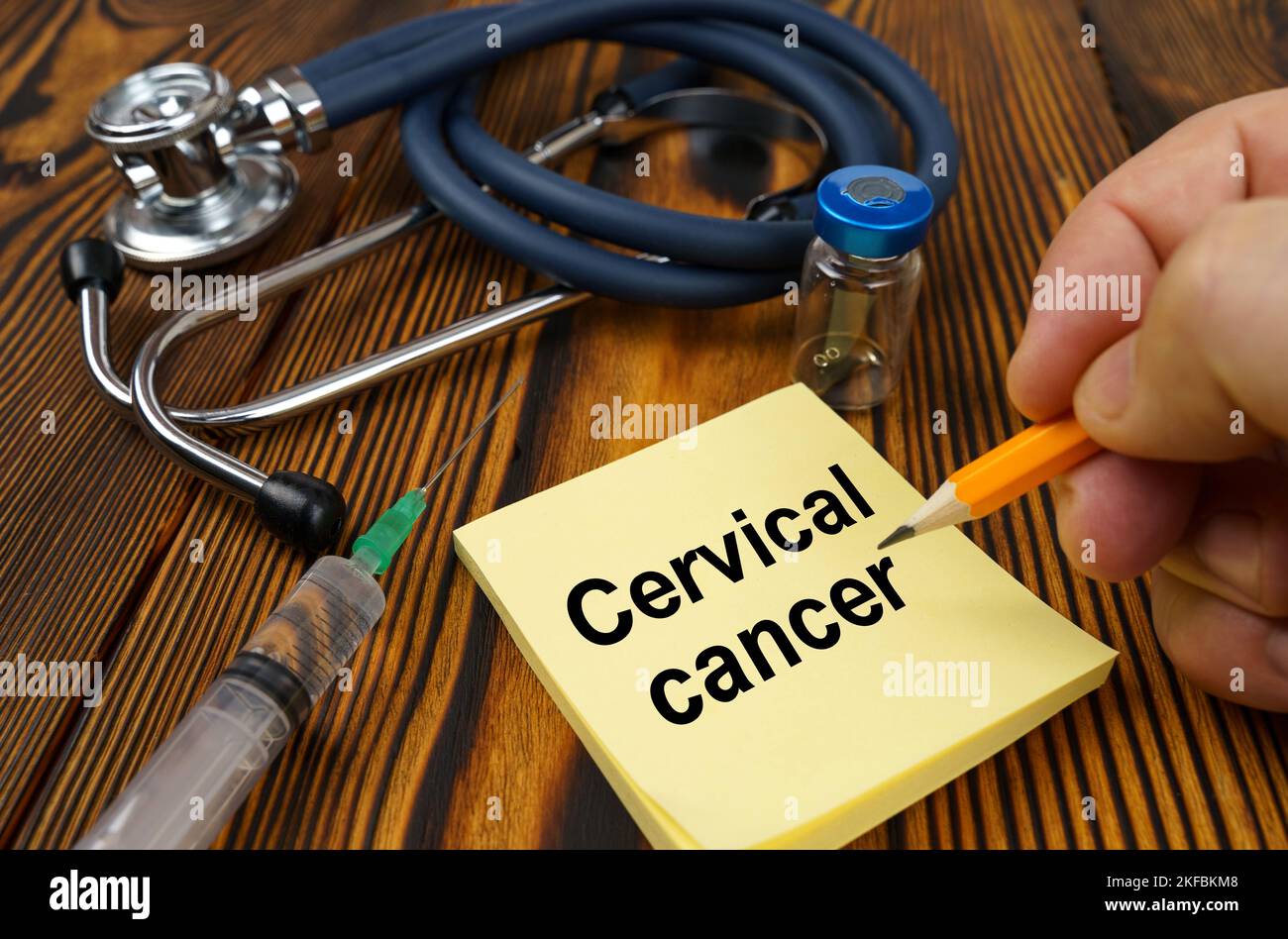 Medical concept. On the table is a stethoscope, a syringe, a man's hand ...