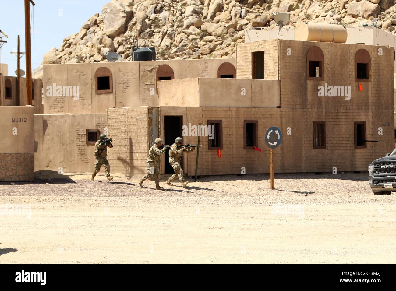 U.S. Army Soldier from 11th Armored Cavalry Regiment exit a building ...