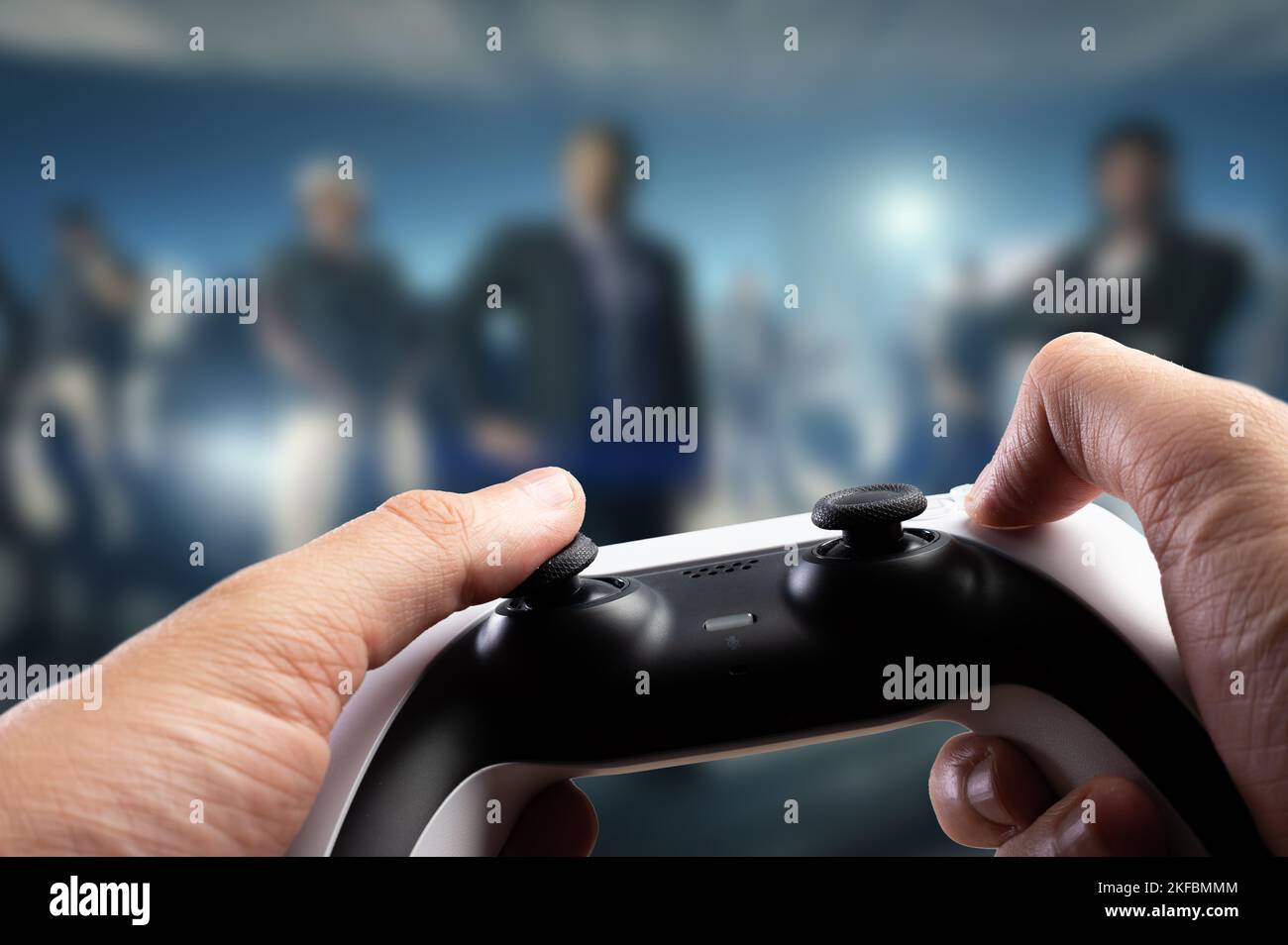 Modern joystick GAM22ICB in the hand of a gamer against the backdrop of ...