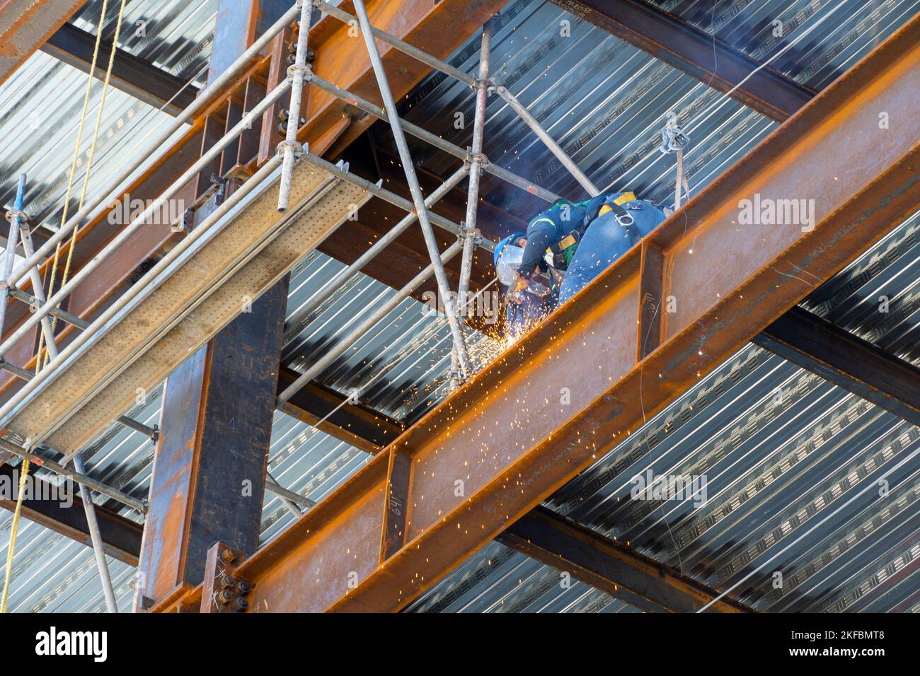 rusted steel structure while a man is welding joints, mexico ...