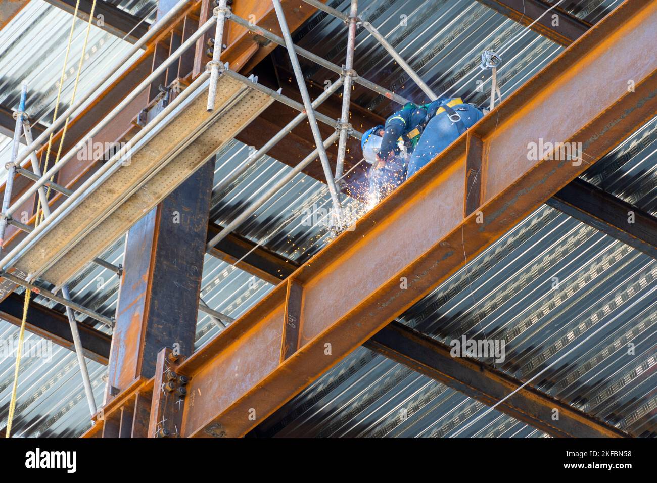 man welding steel on a girder at heights, building structure, mexico ...