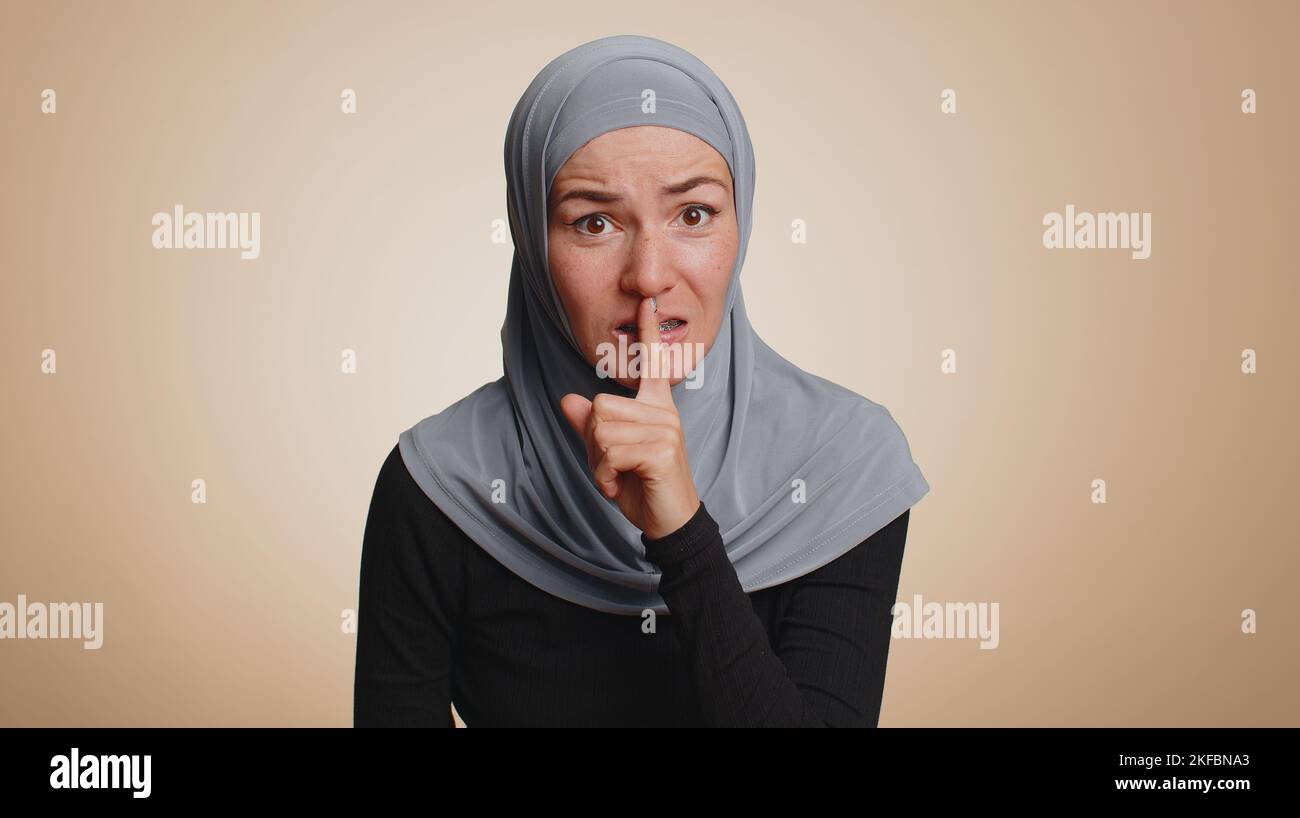 Shh be quiet please. Portrait of millennial muslim woman in hijab ...