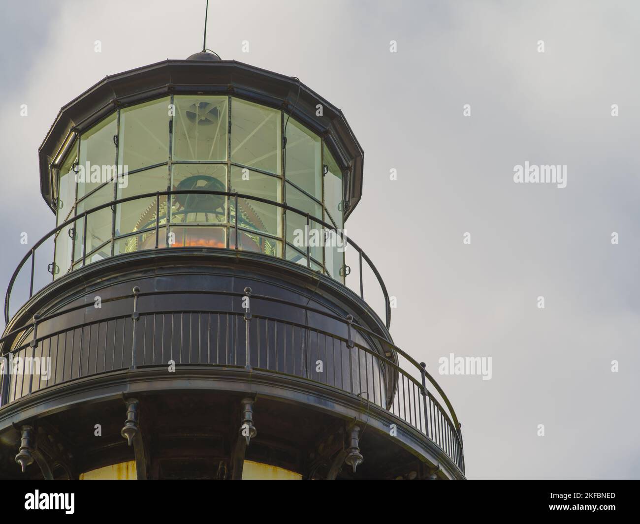Close-up. The huge top of a high lighthouse against a cloudy sky. Great ...