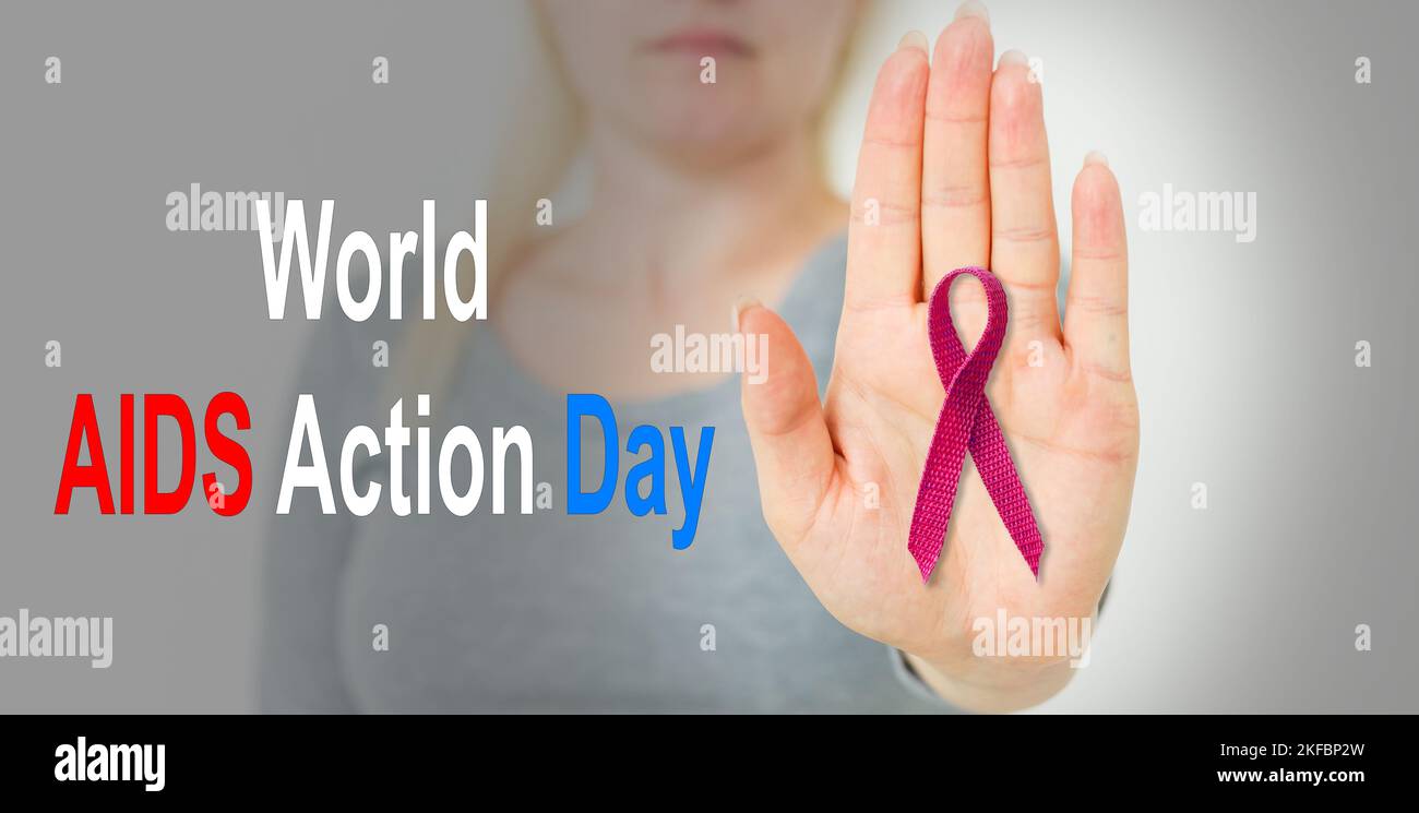 The hand is holding a red ribbon. AIDS awareness sign. World HIV Day ...