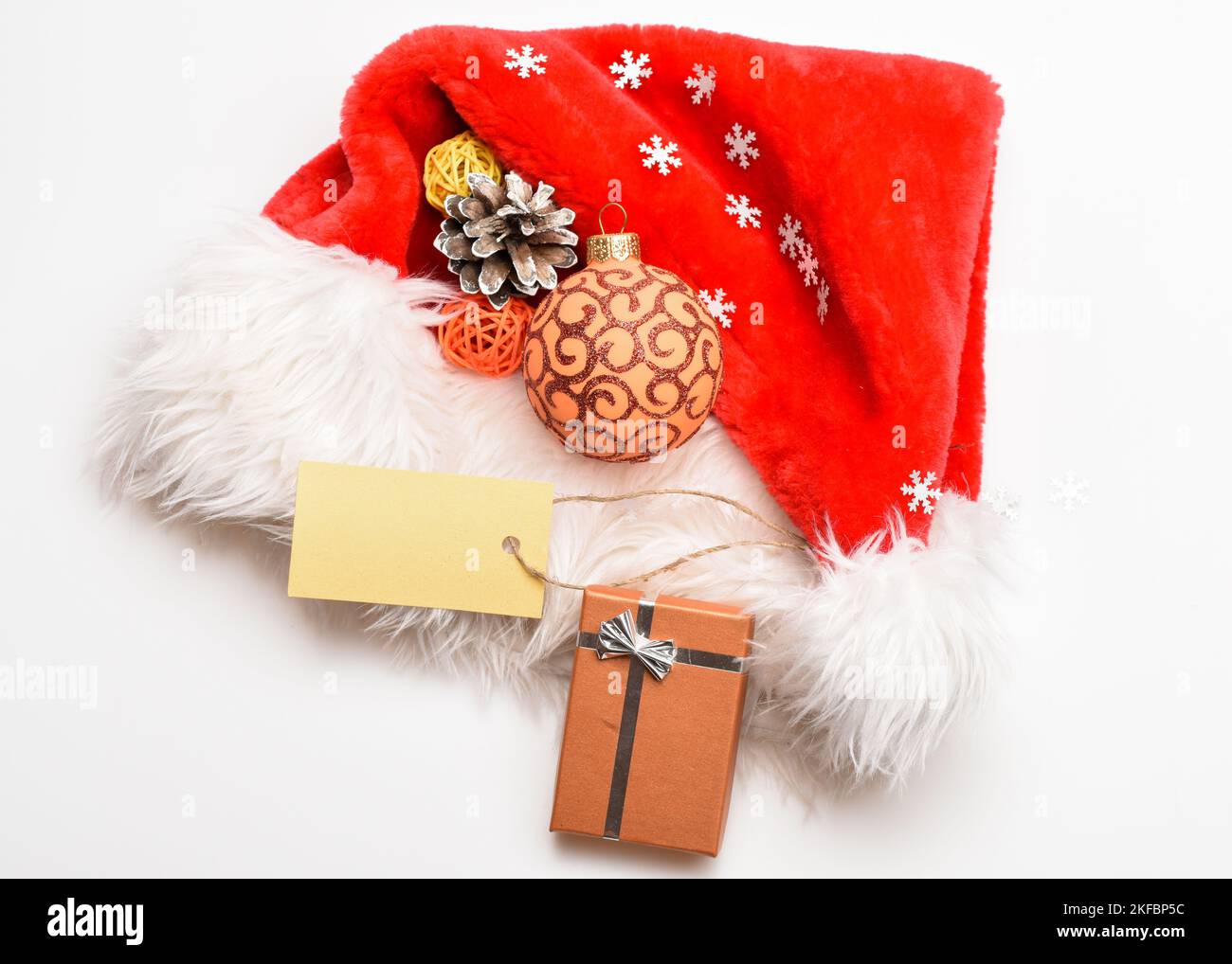 New year and christmas celebration. Santa hat with christmas gift box ...