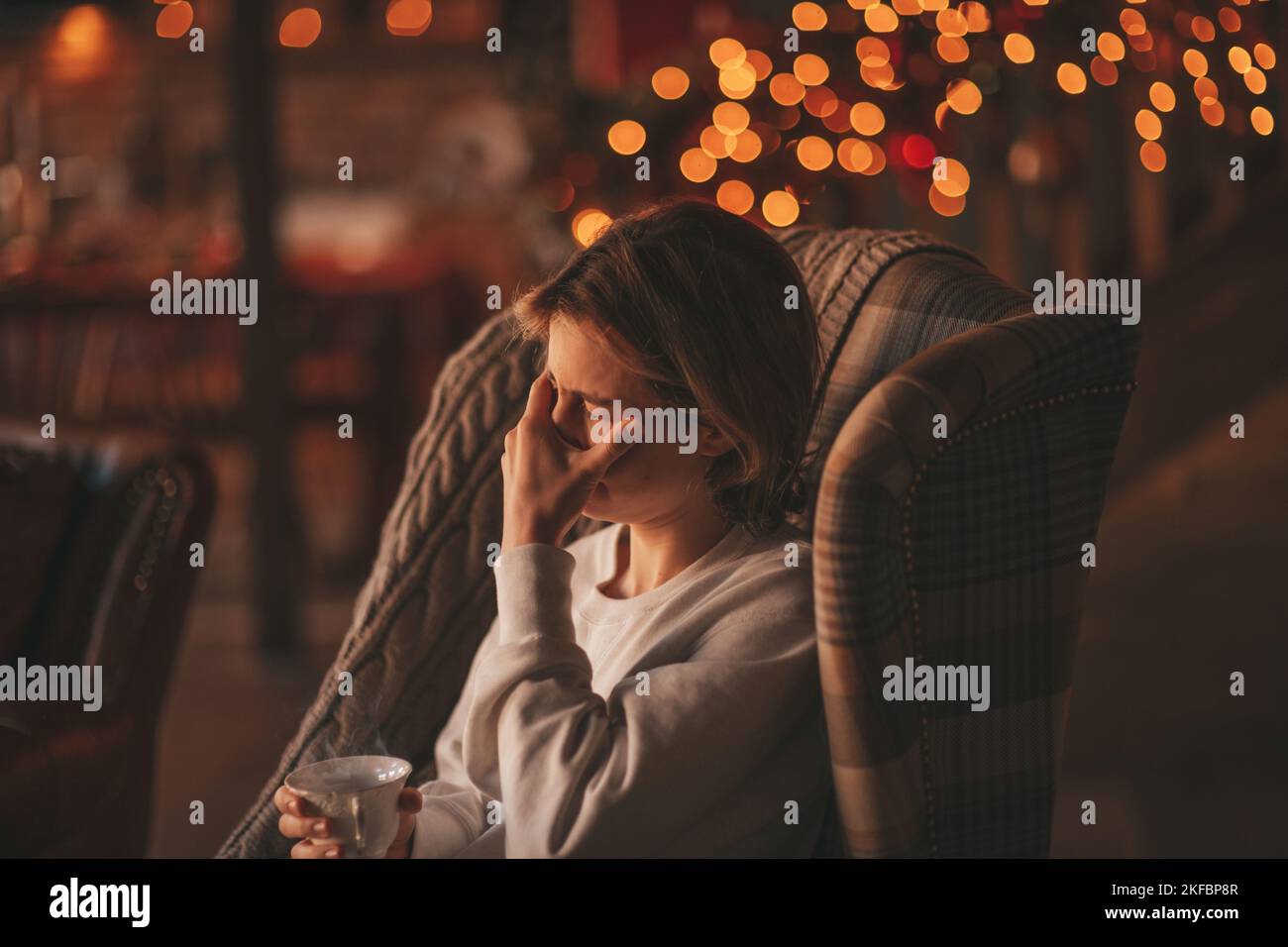 Young teen boy with long hair thoughtful look sad eyes negative mood ...