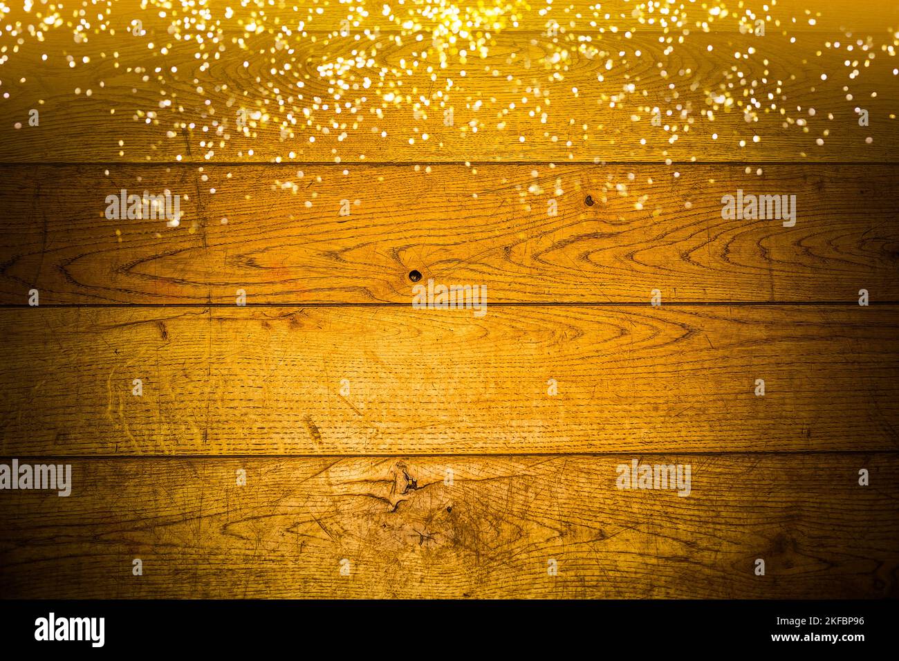 wood board in front of Christmas warm gold garland lights on wooden ...