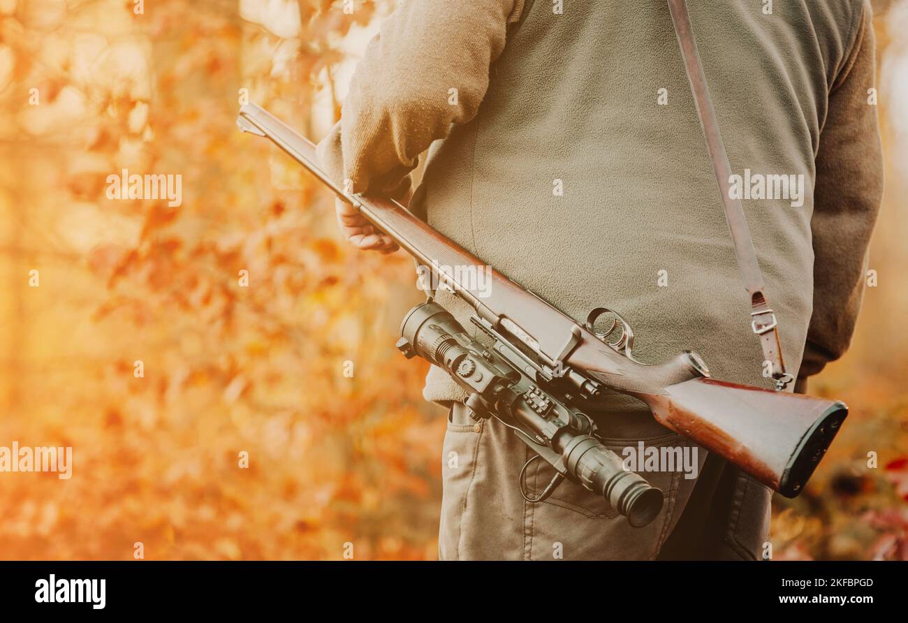 Hunter or ranger with gun or rifle in the forest hunting of some ...