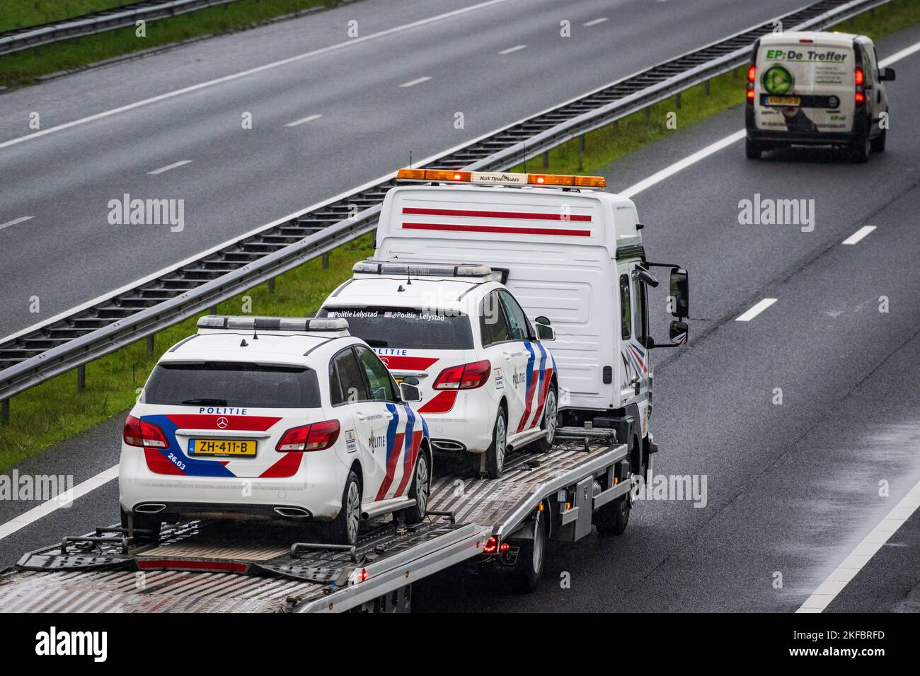 Police cars are transported on a trailer. ANP / Hollandse Hoogte Venema ...