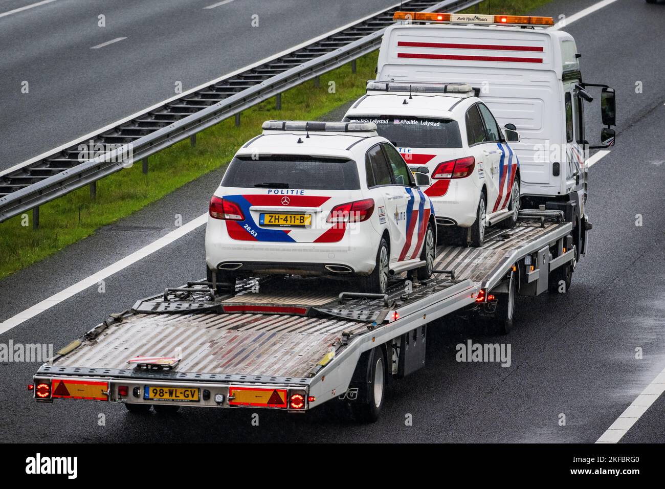 Police cars are transported on a trailer. ANP / Hollandse Hoogte Venema ...