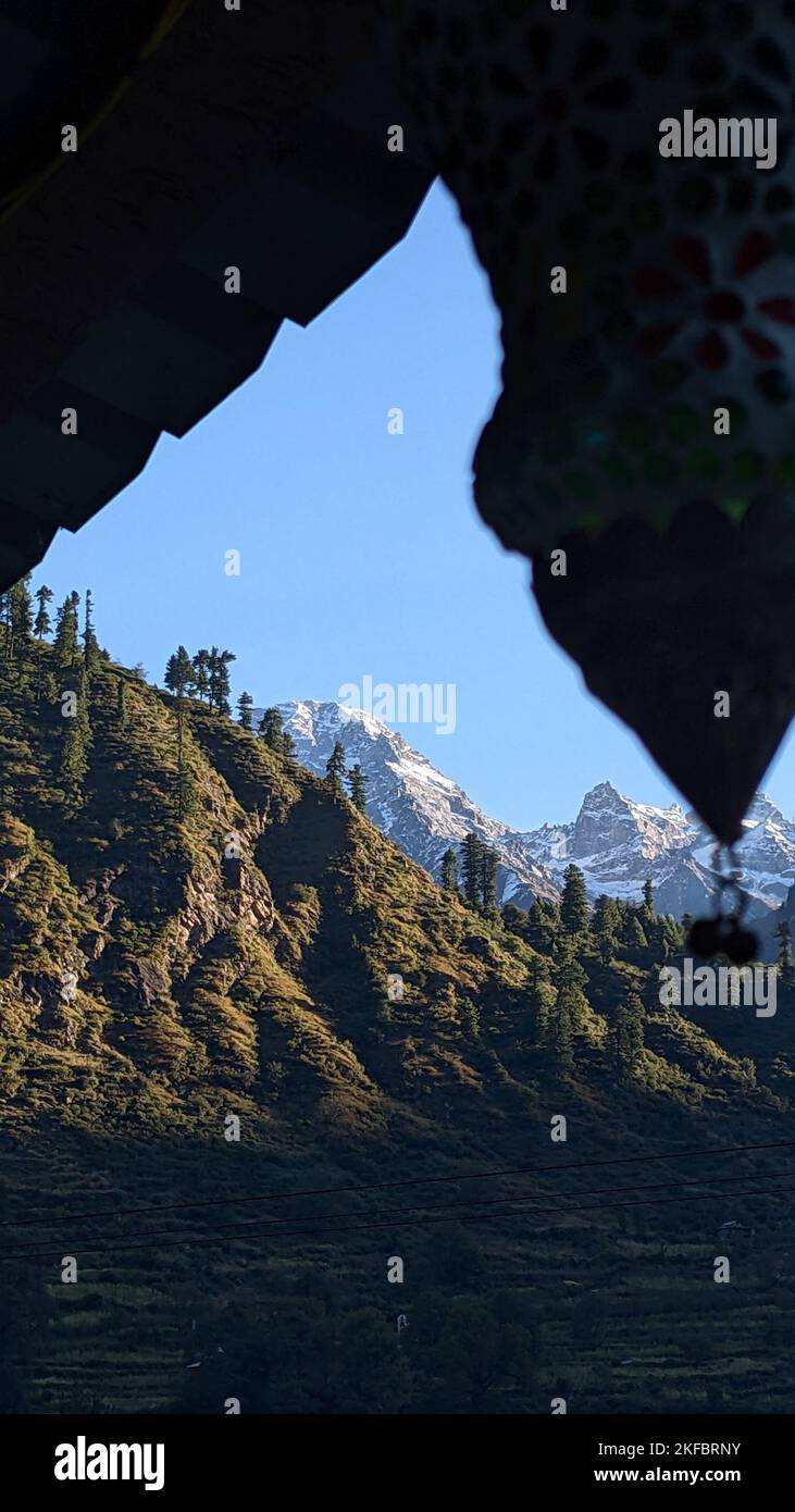 A vertical scenic view of hills and snowy mountains in India Stock ...