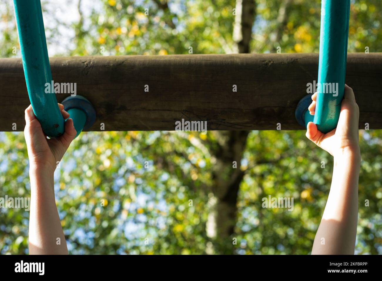 Child Playing on a Climbing Frame Stock Photo - Alamy