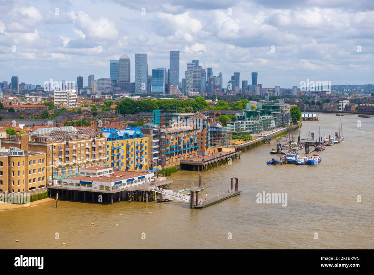 Tower Bridge Wharf on north bank of River Thames with skyscrapers in ...