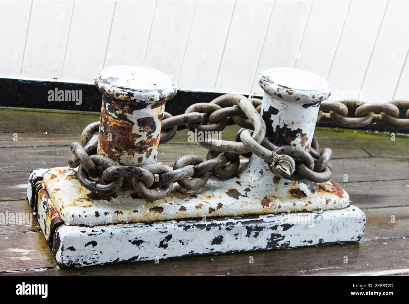 Rusted Dock Cleats with mooring chains attached - grunge -flaking white ...