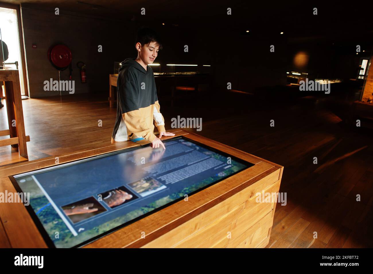 Boy exploring virtuality screen map in museum Stock Photo - Alamy