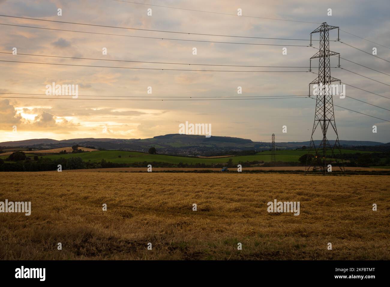 Power Pylons in a farm field Stock Photo - Alamy