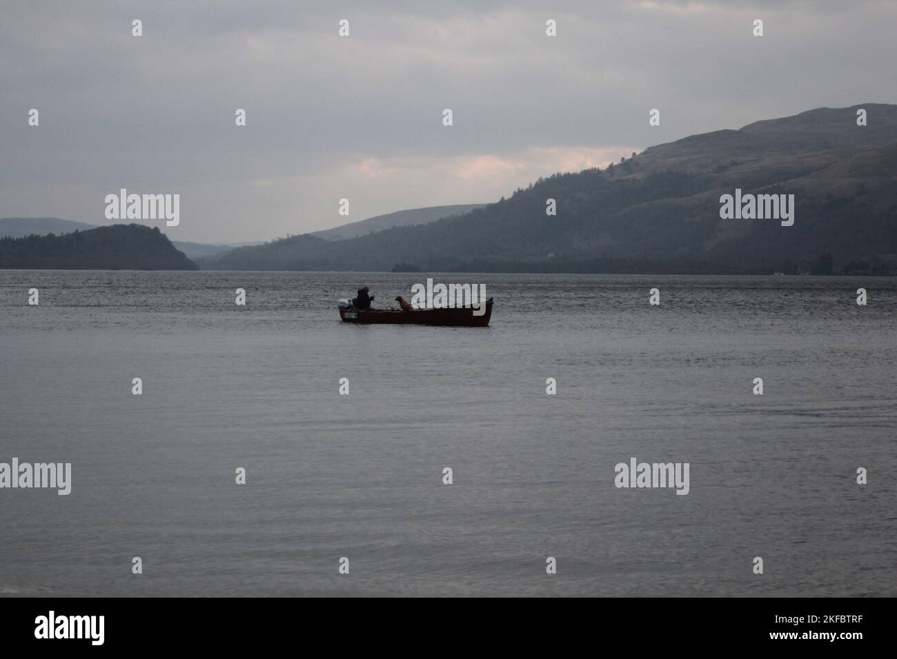 Solitary in a boat fishing in a Scottish Loch Stock Photo - Alamy