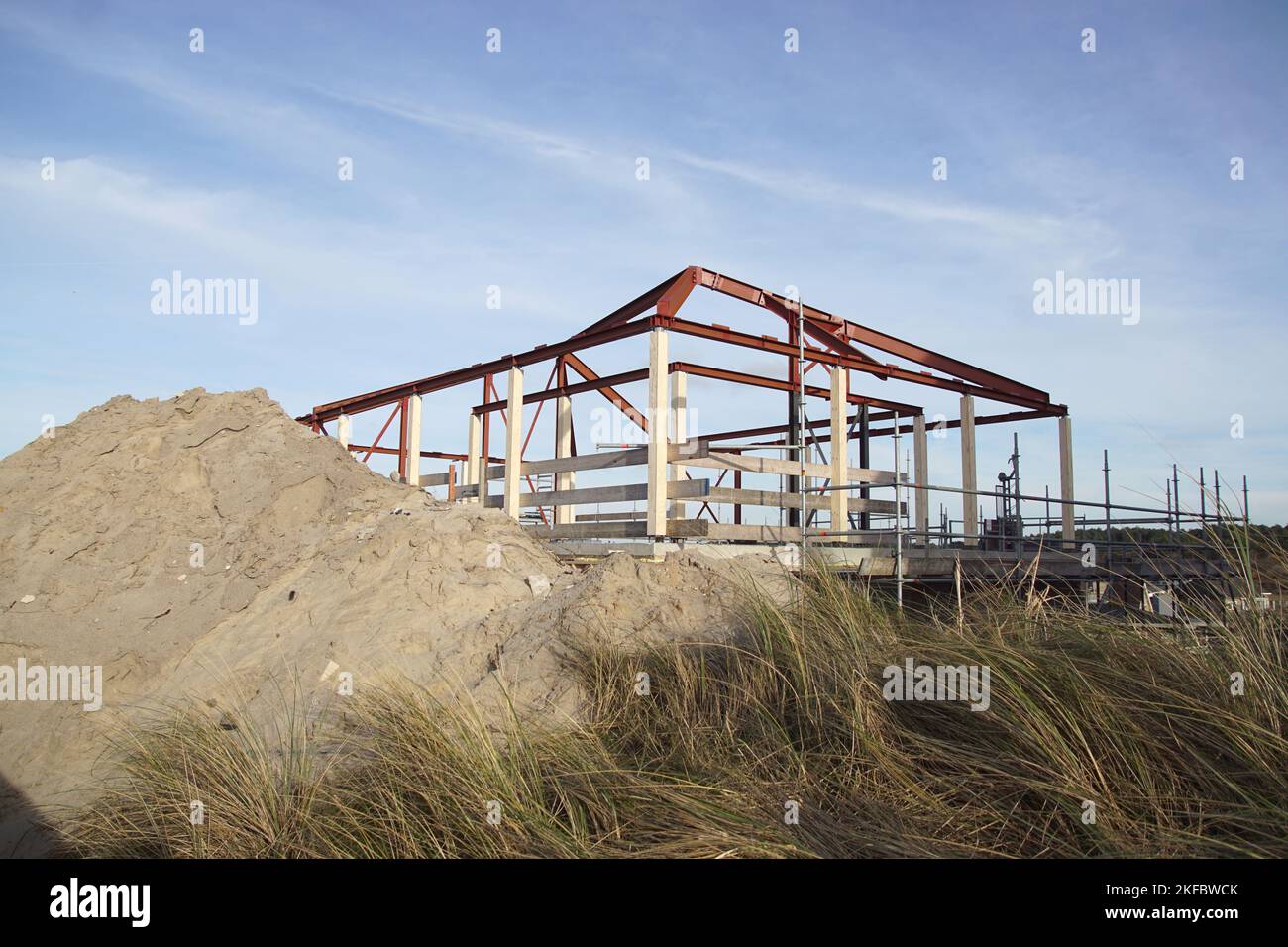 Skeleton frame, framed structur of a house being built in the sand ...