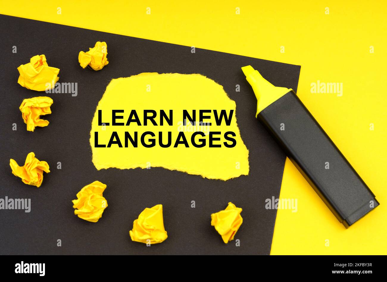 Business and education concept. On a yellow background, a black sheet ...