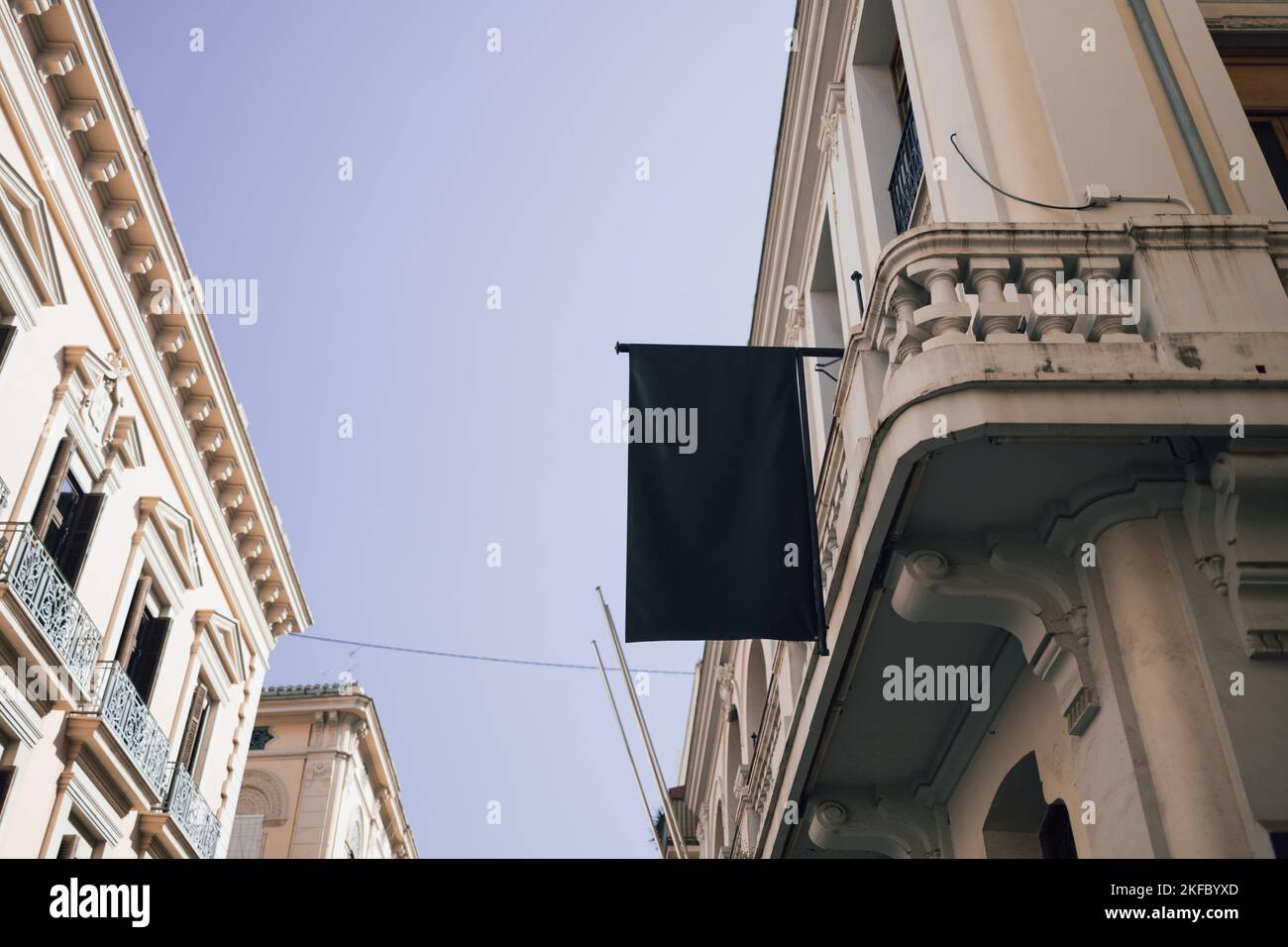 empty blank black banner for advertisement mounted on grey fence of ...